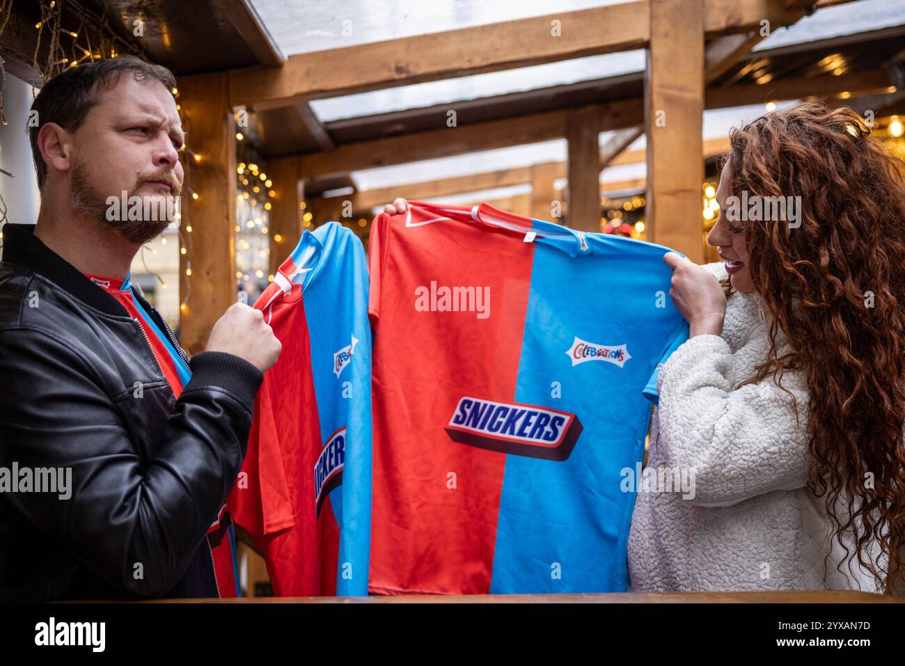 EDITORIAL USE ONLY Football fans wear a limited-edition half-and-half ...