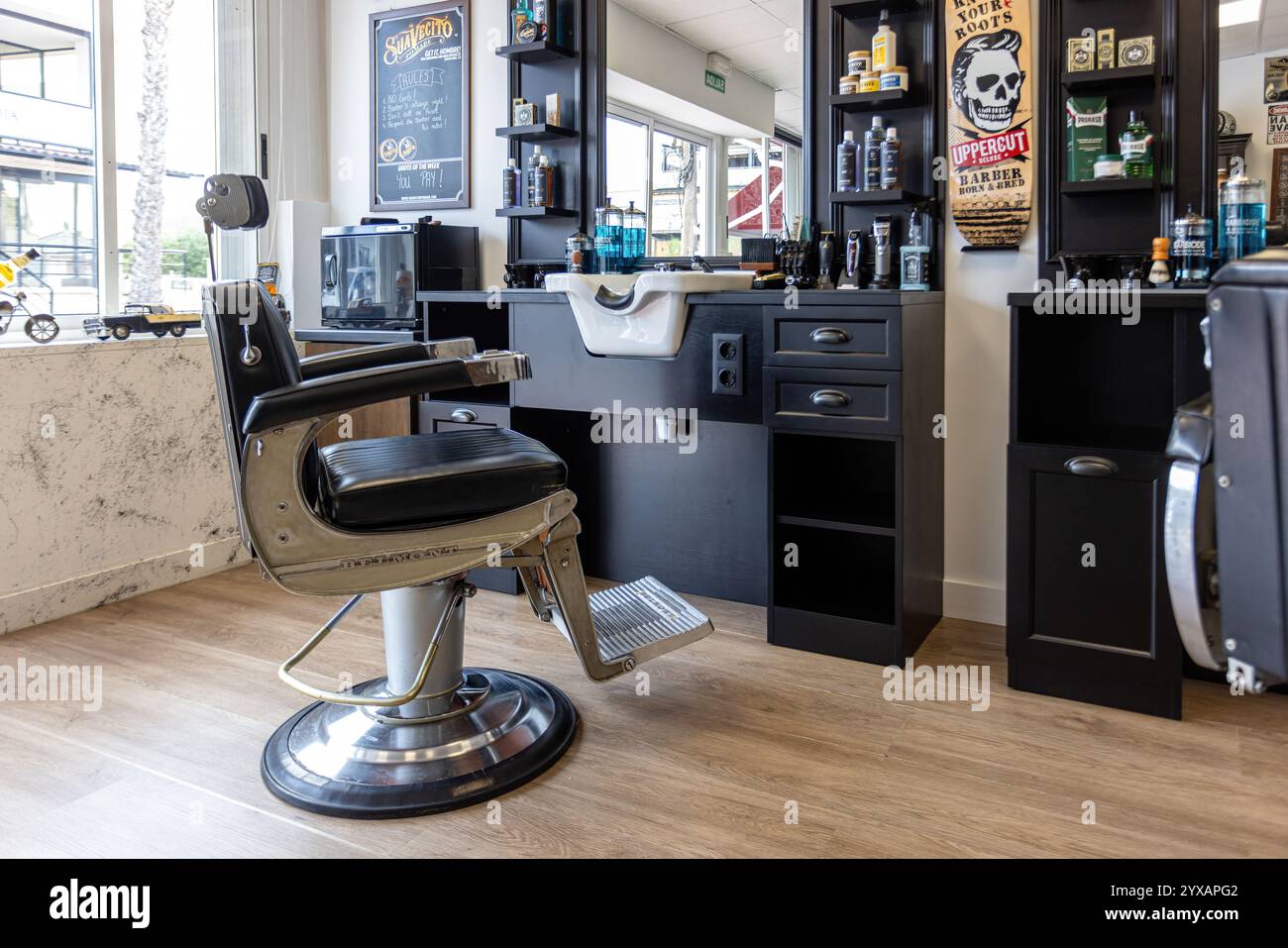 A professional barber station featuring a Belmont chair, built-in sink ...