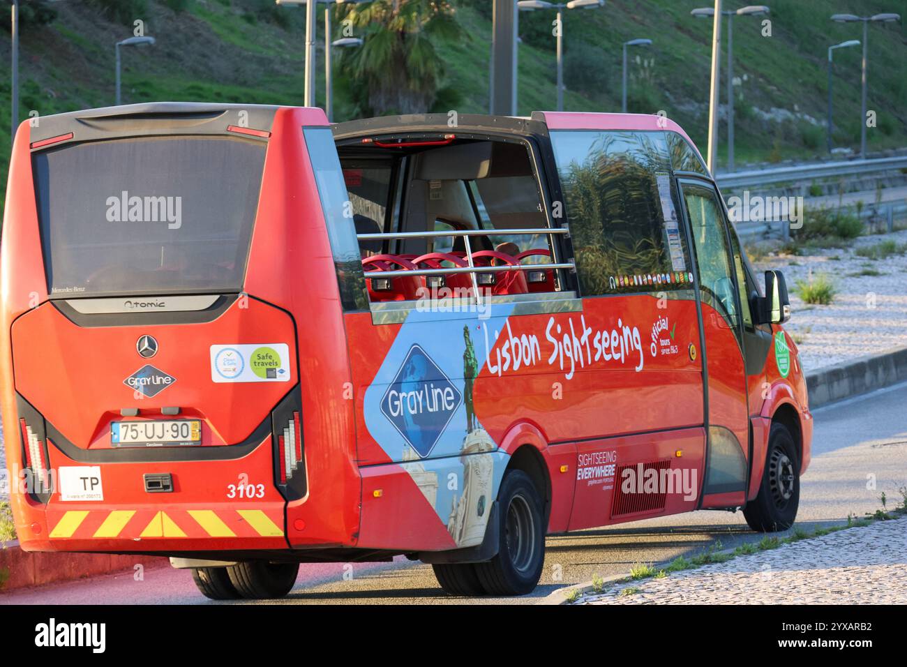 Red gray line open top tour bus parked on the street in lisbon ...