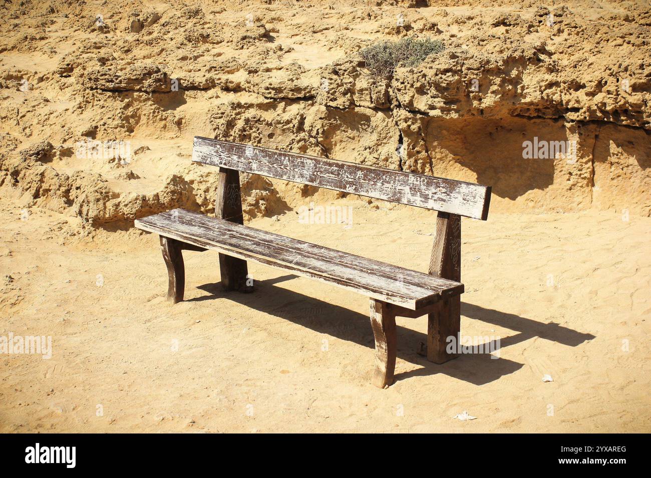 A lonely wooden bench on the seaside. Old bench in Cape Capo Greco ...