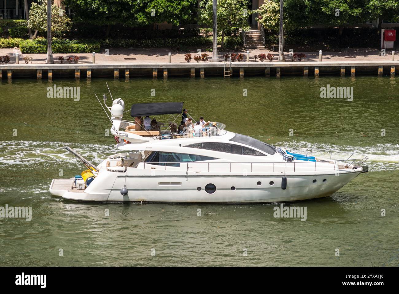 Miami, FL, USA - March 30, 2024: Motorboat sailing on the Miami River ...