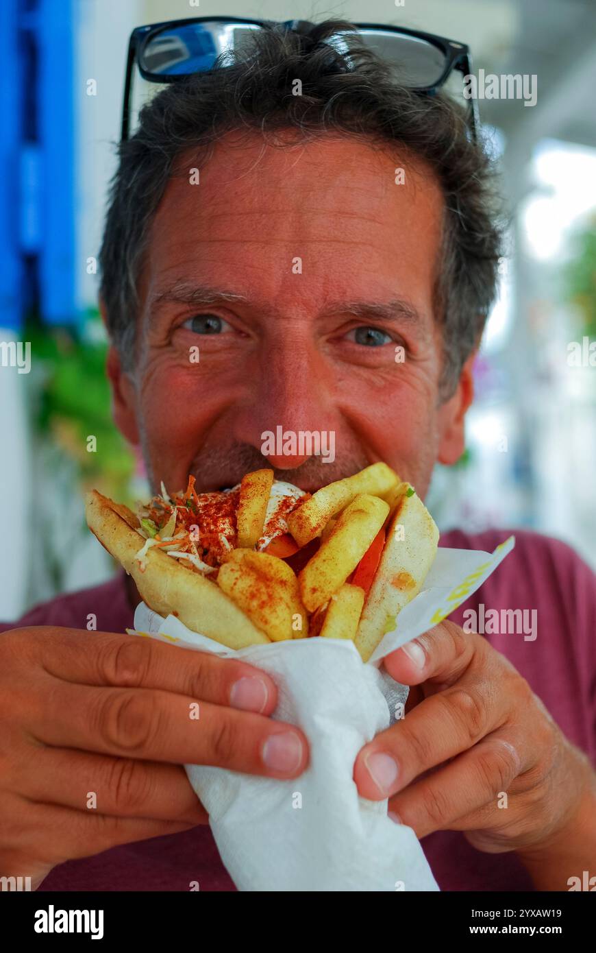 Man eating souvlaki hi-res stock photography and images - Alamy