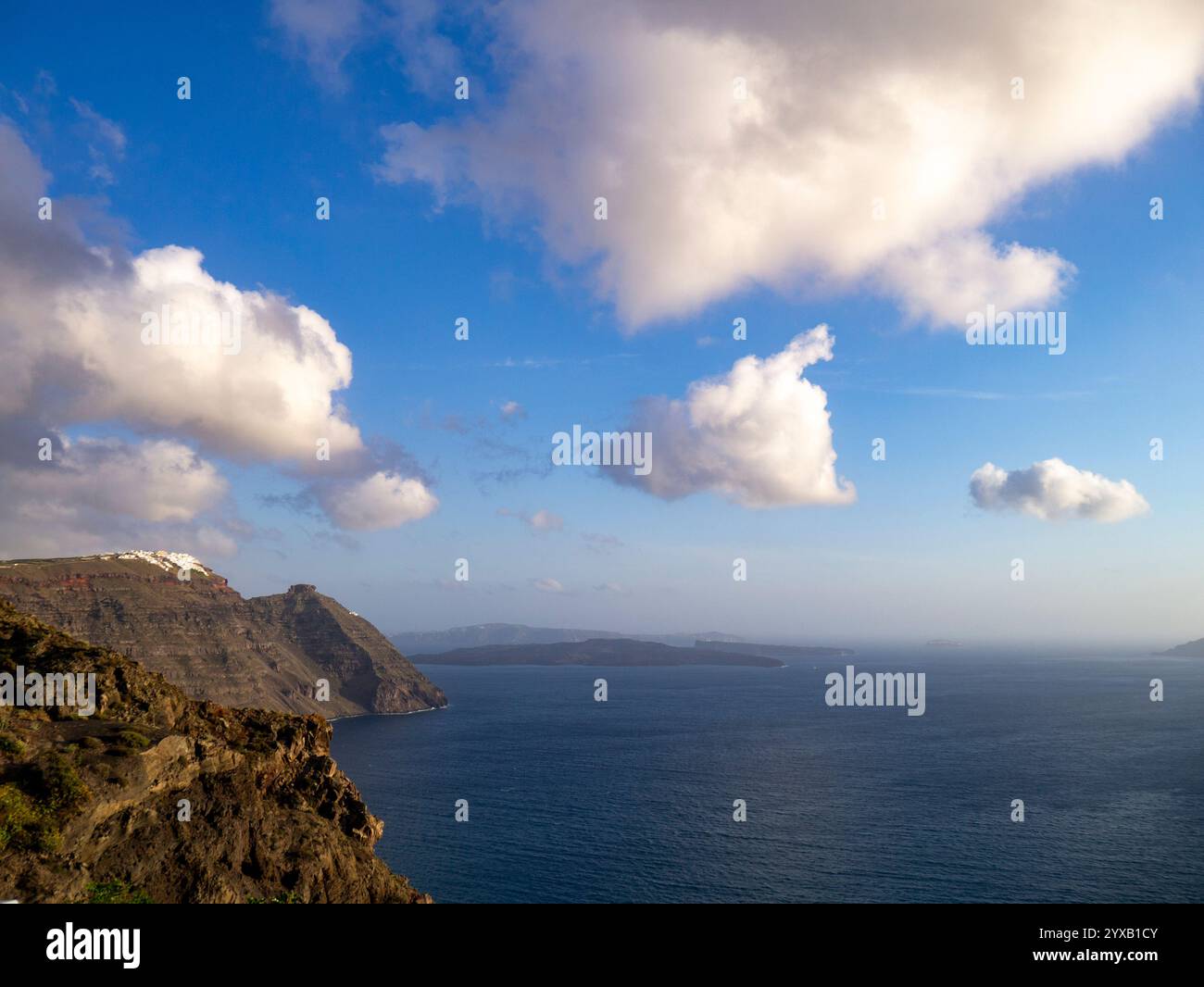 View of Thira and the sea from the Fira to Oia hike. Thira is the ...