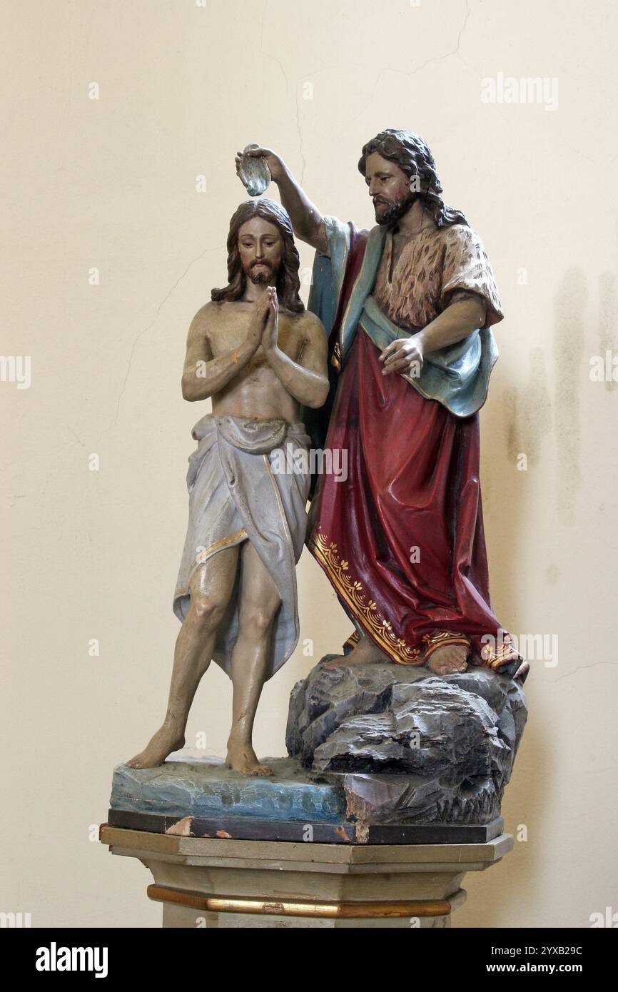Baptism of the Lord, statue on the baptistery in the parish church of ...