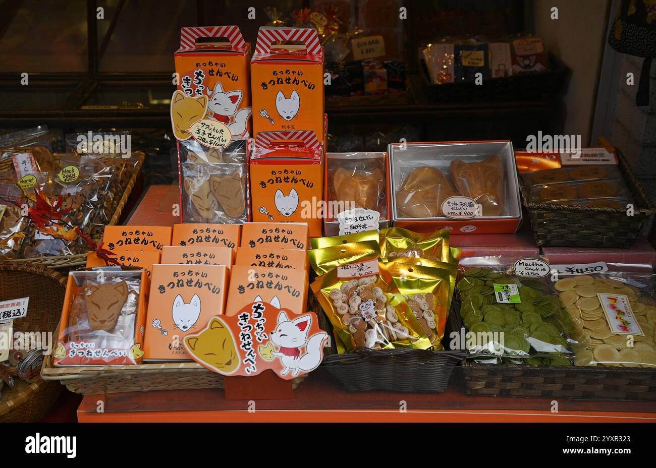 Japanese matcha and fox dog cookies on display at the Fushimi inari ...