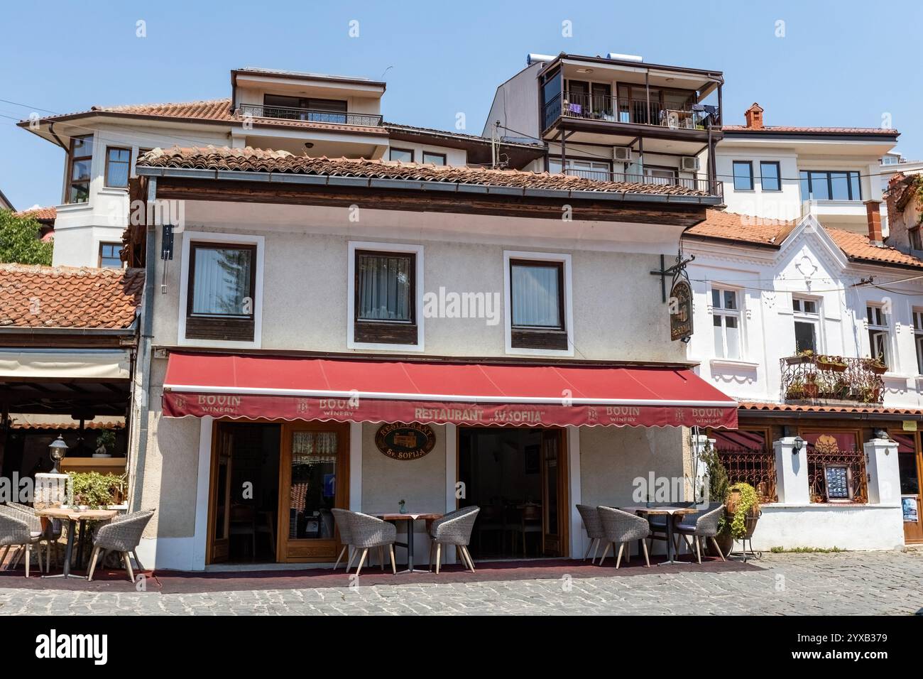 Beautiful traditional cafe with outdoor tables in the center of ...