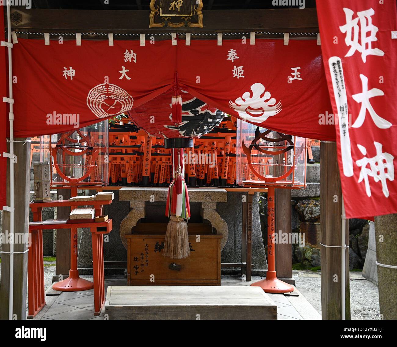 Shinto graveyard at the Shrine Fushimi Inari-taisha with Otsuka stones, kitsune foxes and ...