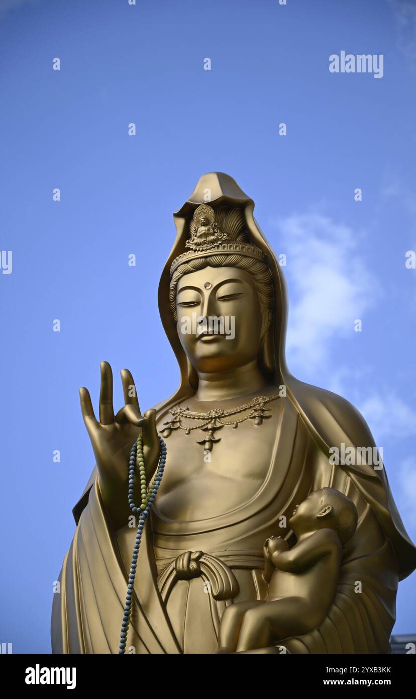 Bronze statue of Jibo Kannon near the Shinto Shrine Fushimi inari ...