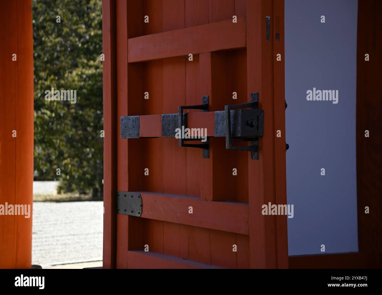 Antique handcrafted vermilion portal of the Nikka-mon Gate at the Kyoto ...