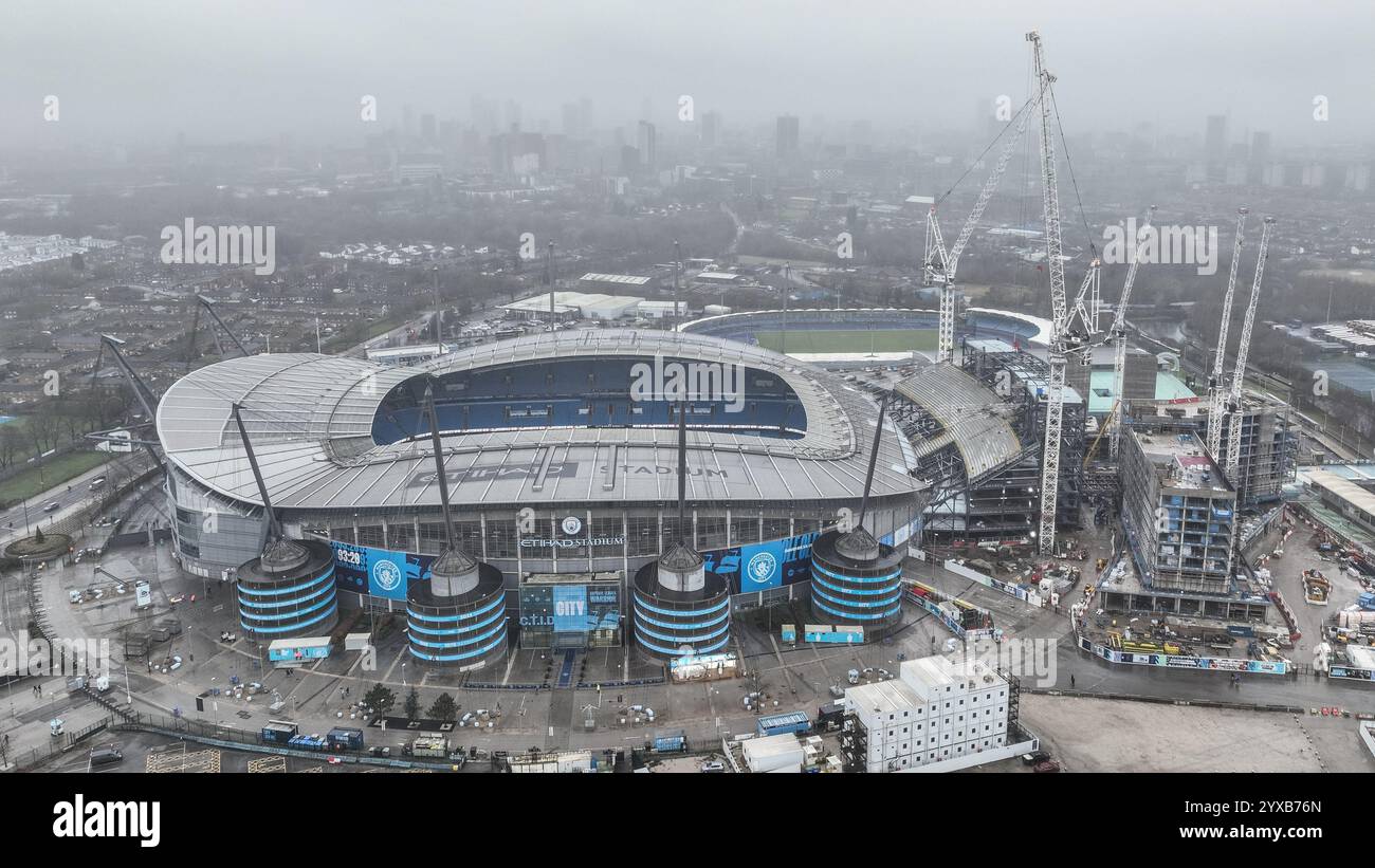 An aerial view of the Etihad Stadium and a misty City of Manchester in ...
