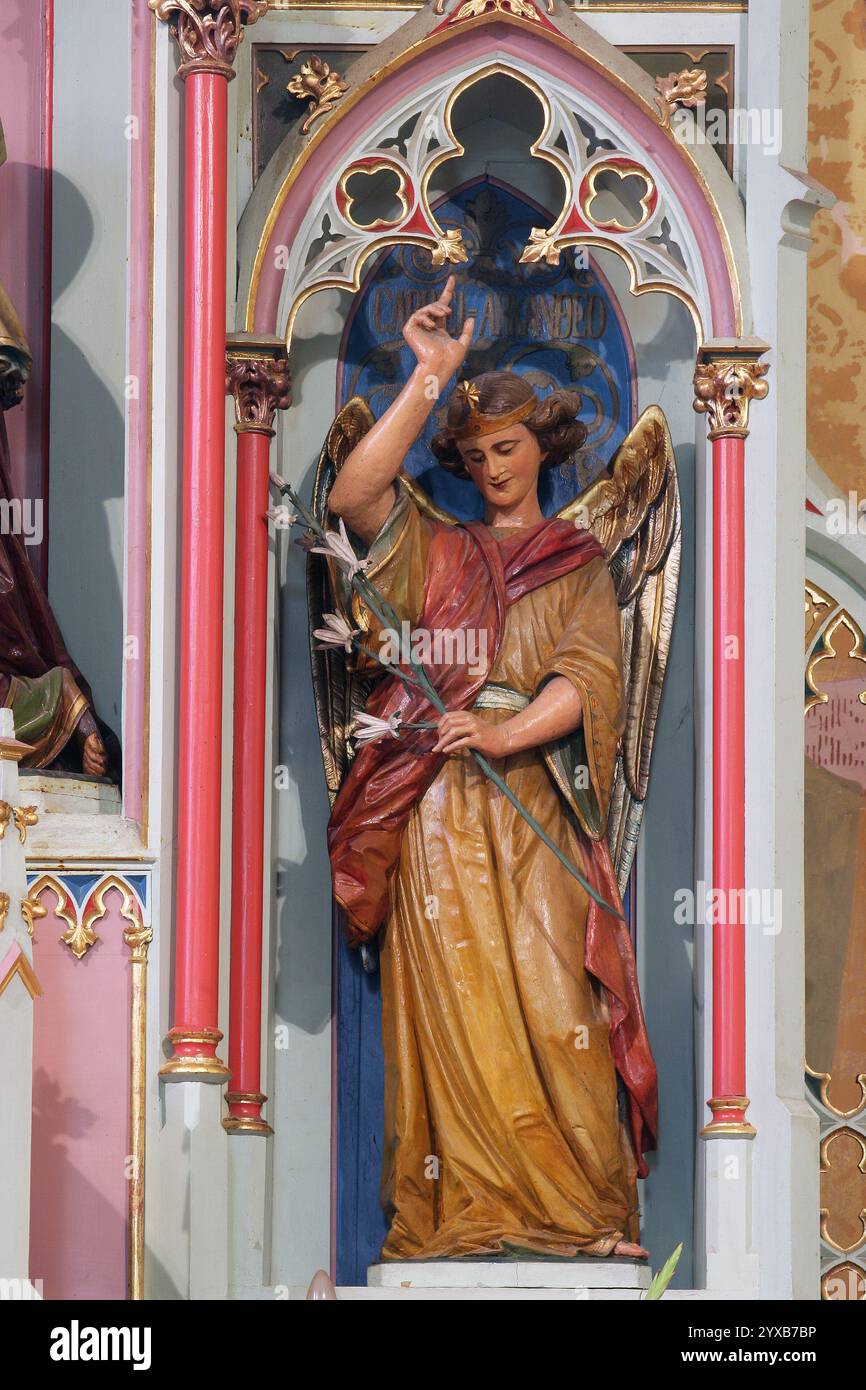 Archangel Gabriel, statue on the main altar in the parish Church of the ...