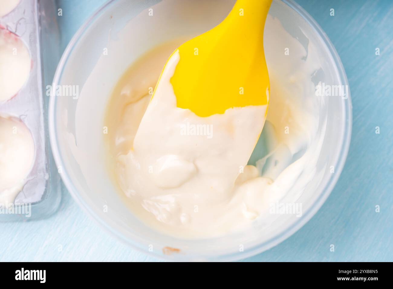 Tempering of white professional chocolate. The process of making ...