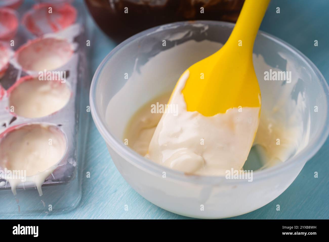 Tempering of white professional chocolate. The process of making ...