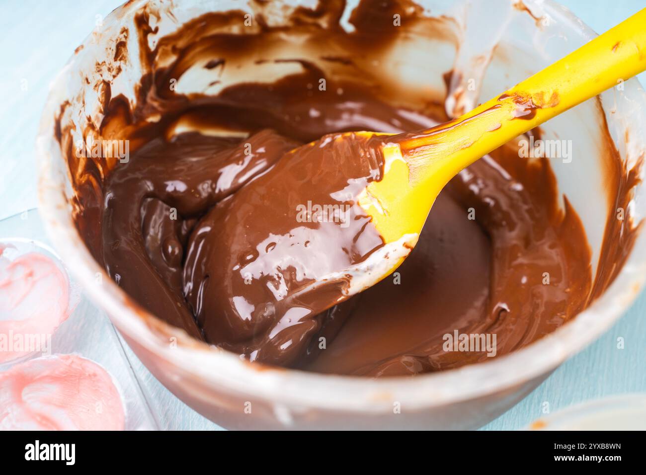 Tempering dark professional chocolate. The process of making handmade ...