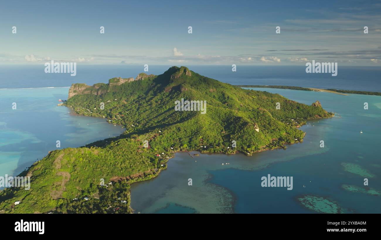 Aerial view of Maupiti, a volcanic island in French Polynesia, verdant ...