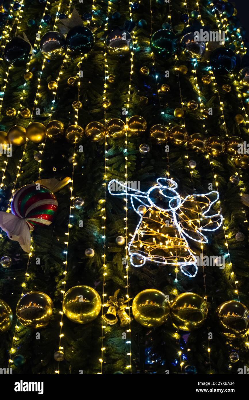 Christmas decorations on the Christmas tree. An angel singing on a ...