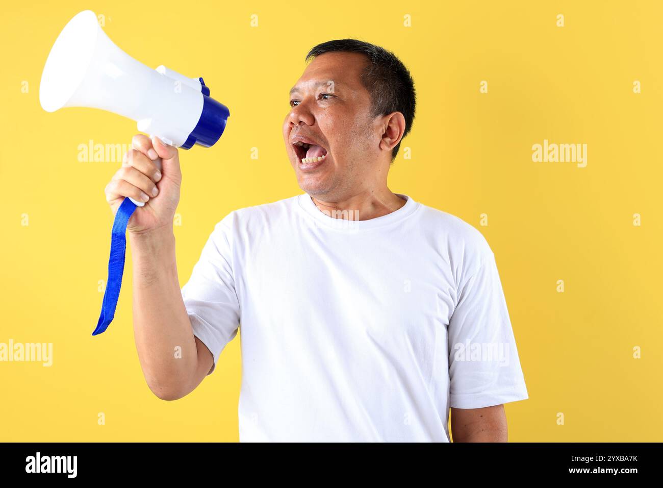 Portrait of Middle Age Asian Man Shouting Using Megaphone, Wearing ...
