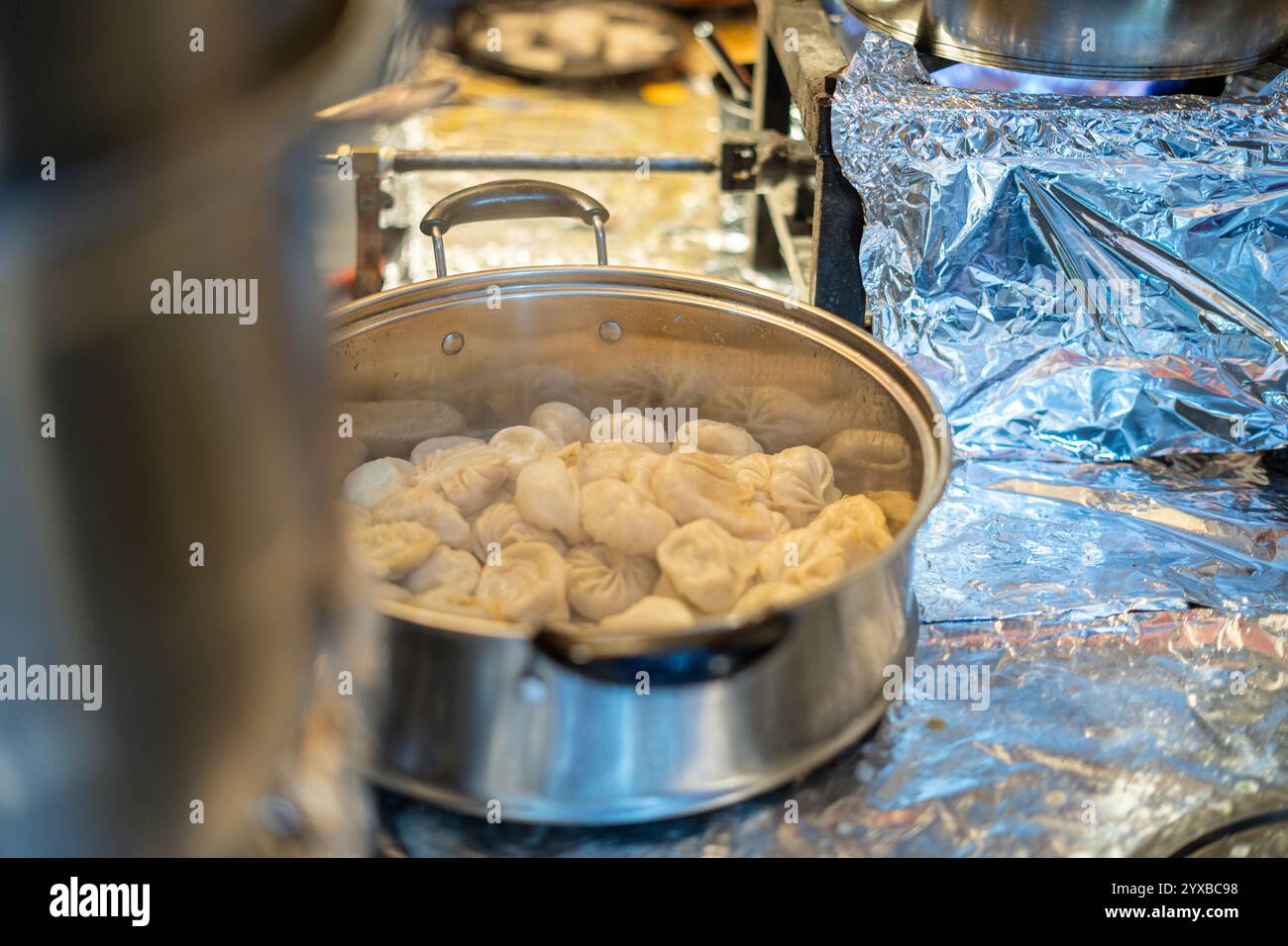 metallic steamer used to make momos dumplings bao a popular street food ...