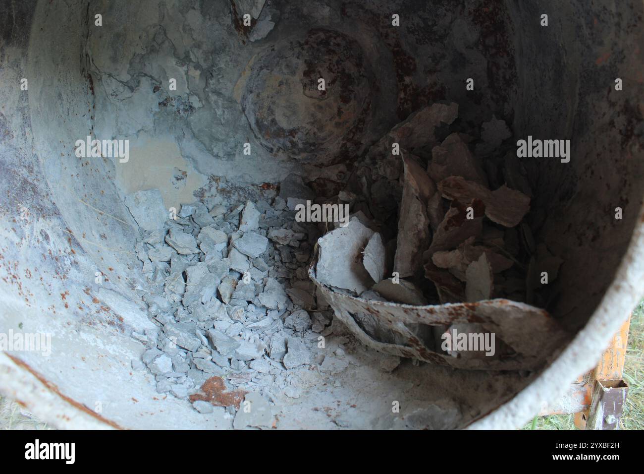 construction waste in a construction bucket mixer. The concept of the ...