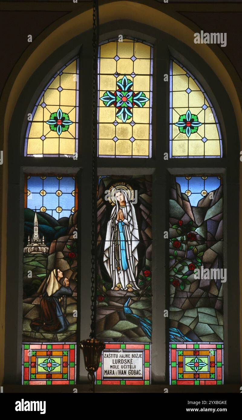 Our Lady of Lourdes, stained glass window in the parish church of Saint ...