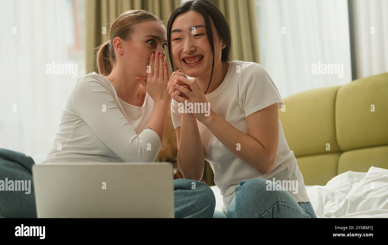 Multiracial friends women Caucasian woman whisper secret talk secrecy ...