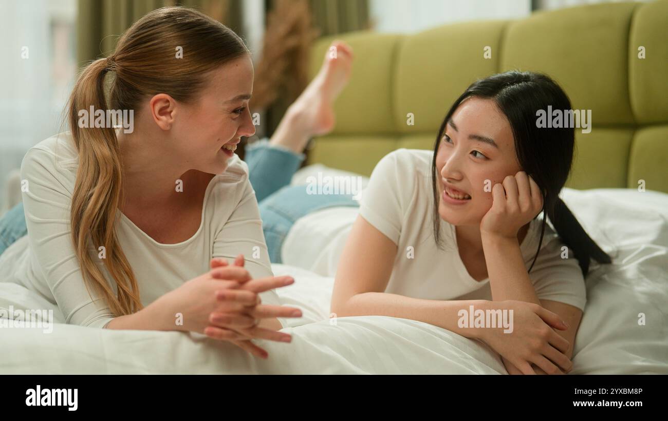 Two happy multiracial multiethnic women friends female diversity girls ...