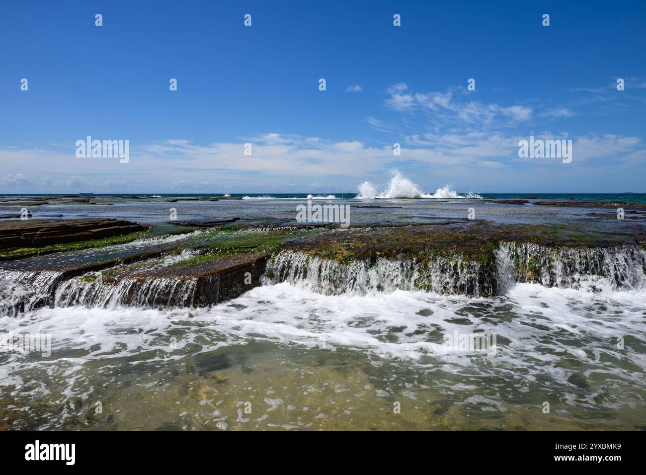 Ocean waves breaking over rocks Stock Photo - Alamy