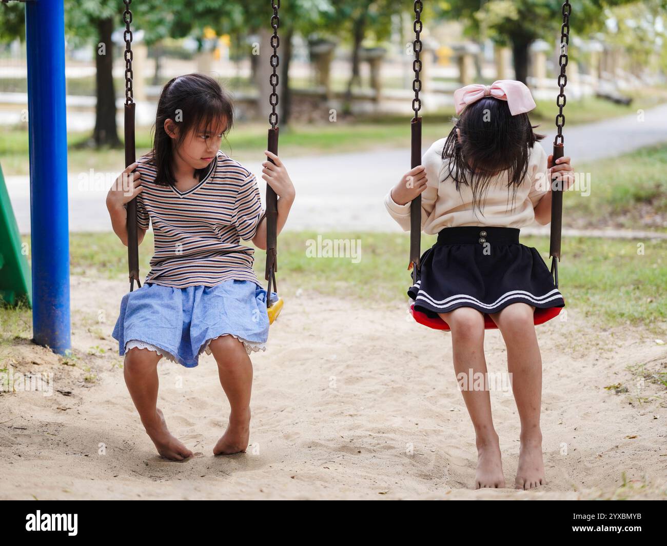 Two little siblings had a fight in the park. Children are upset and ...