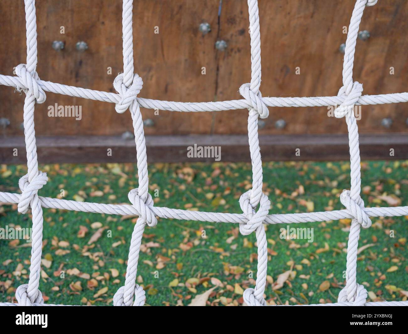 Rope net tied for climb in the playground Stock Photo - Alamy