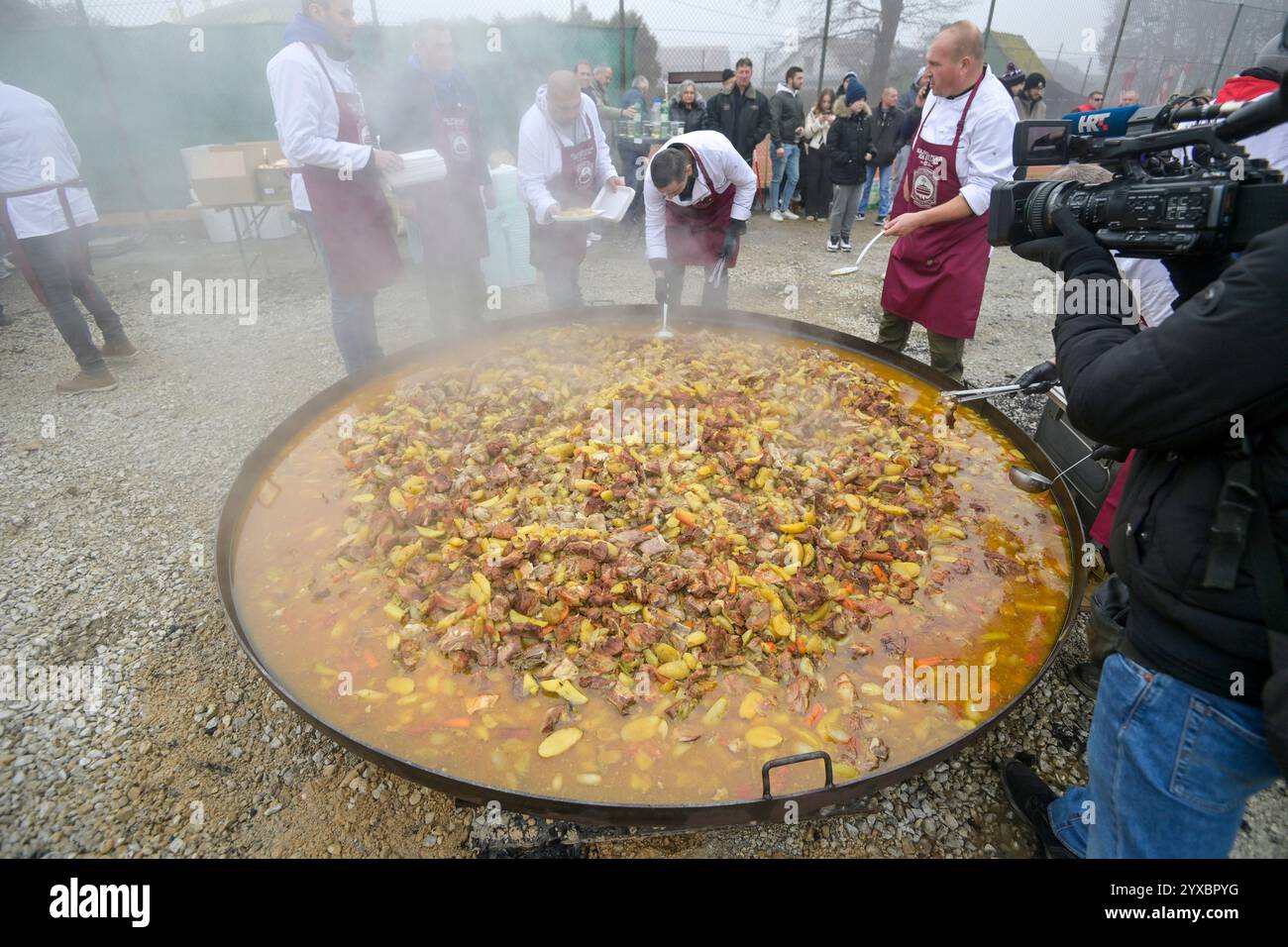 Oroslavje, Croatia. 15th Dec, 2024. People cooks the largest 'peka' in ...