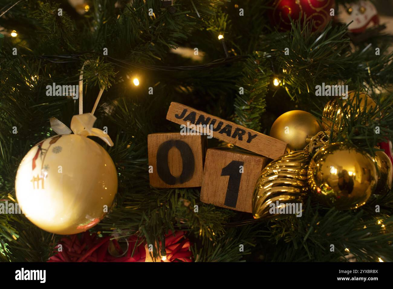 new year's eve with the date witten on a Christmas tree through a ...