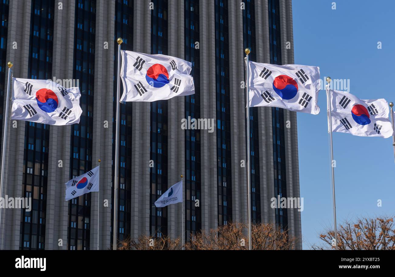 Seoul, South Korea. 15th Dec, 2024. South Korean flags are flying in the wind at the government ...