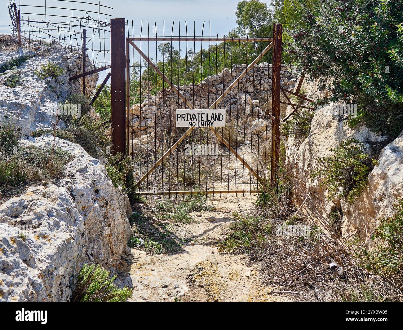 gates in the field with a sign saying ‘private land no entry' Stock ...