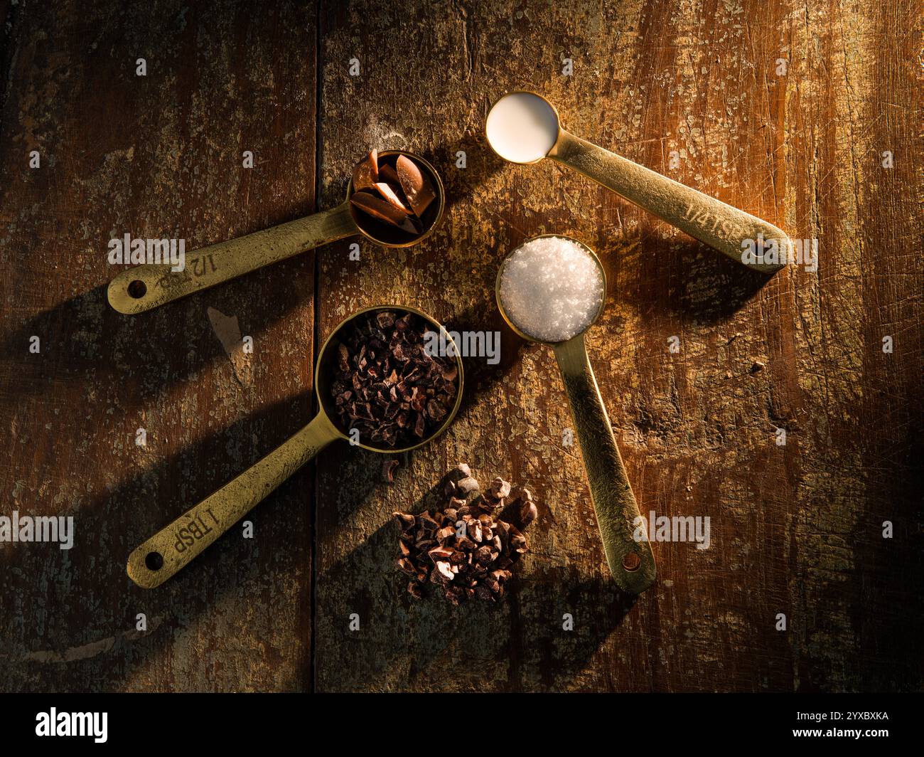 Golden Measuring Spoons with Ingredients Chocolate Cocoa Sugar Milk on ...