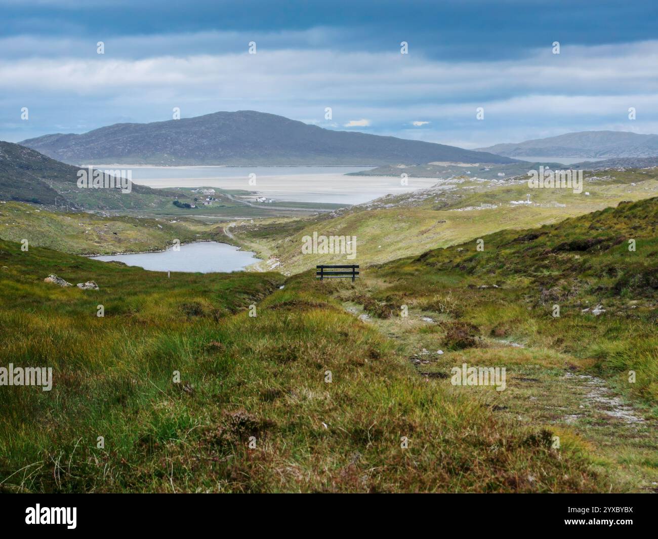 View down Coffin Road to Luskentyre beach with bench and loch, Isle of ...