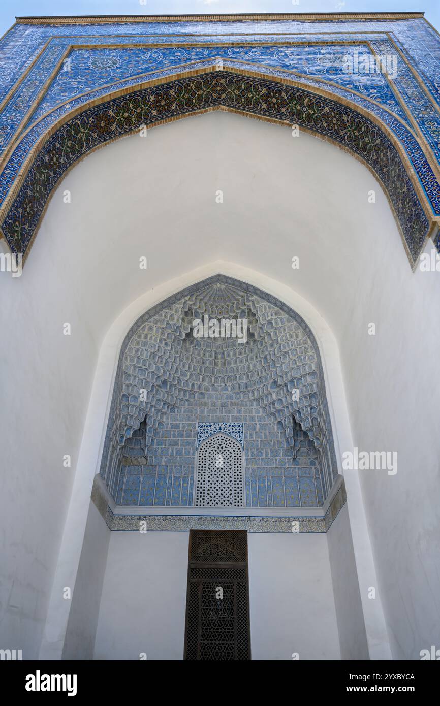 A white portal with a concave dome, ancient relief molding, mosaics and ...