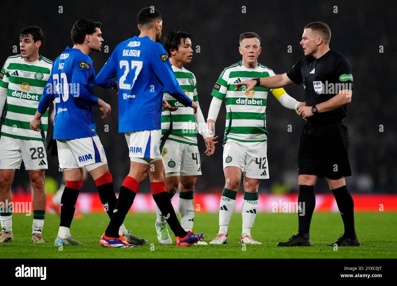 Celtic's Callum McGregor (second right) speaks with referee John Beaton ...