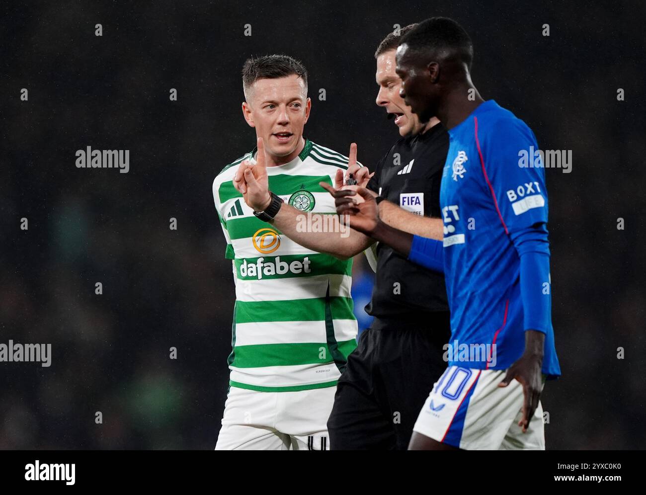 Celtic's Callum McGregor (left) speaks with referee John Beaton during ...