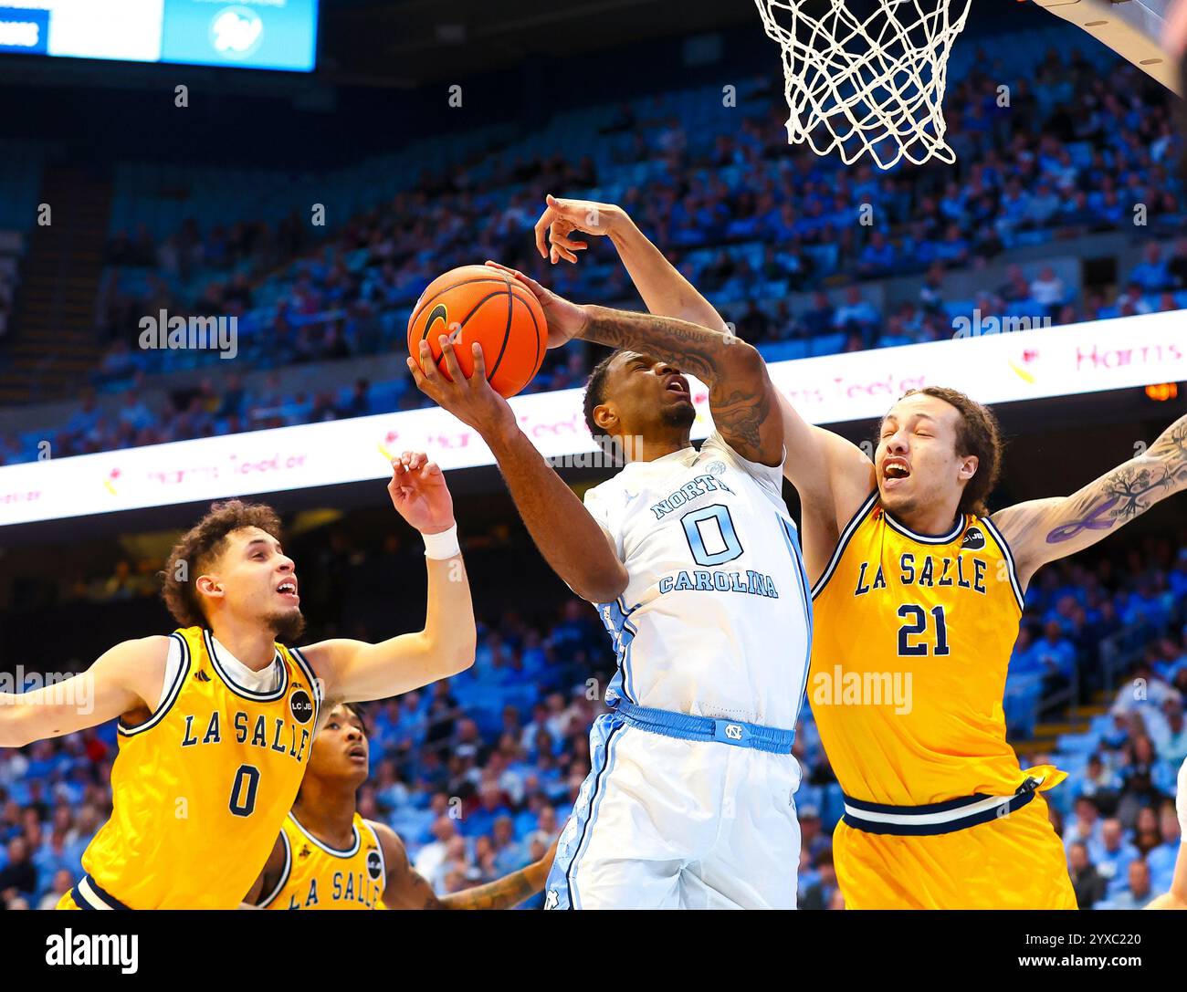 December 14, 2024: North Carolina senior Ty Claude (0) gets fouled by ...