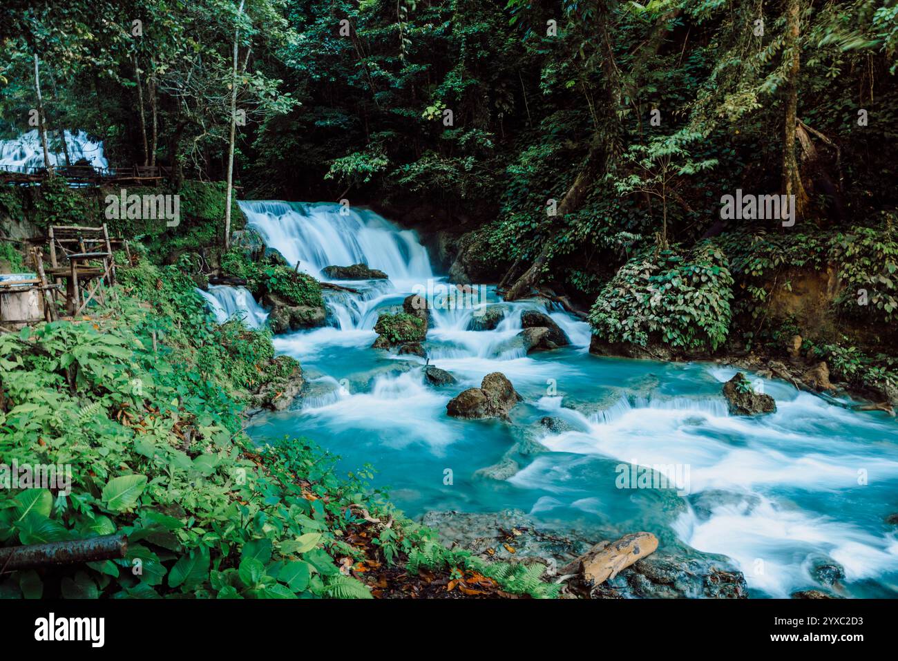 River with blue water and cascade waterfalls in tropical jungle Stock ...