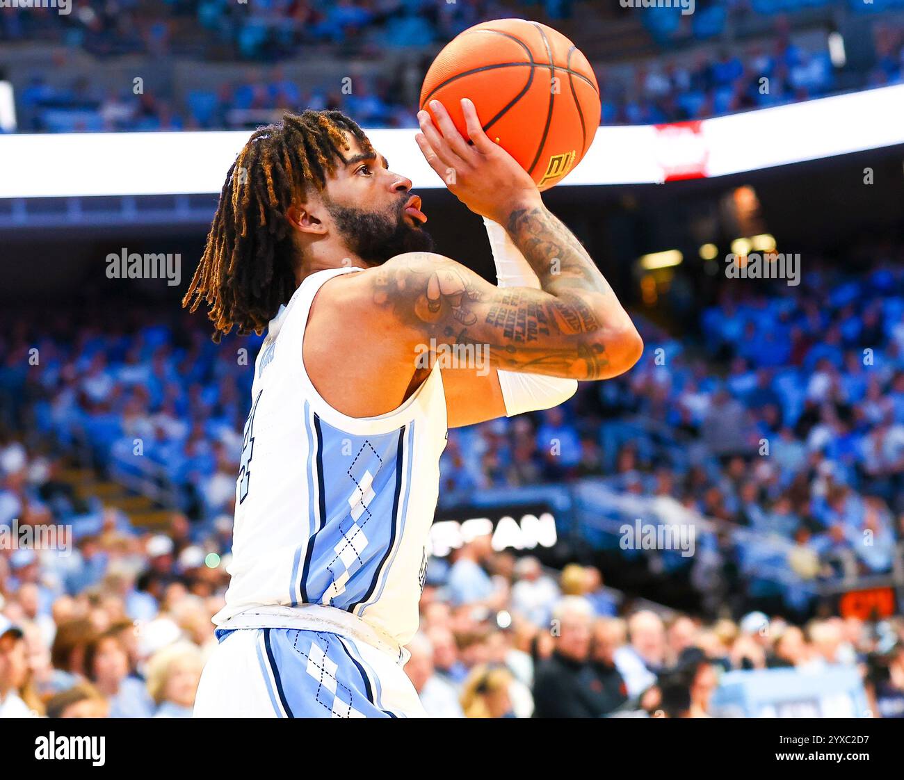 December 14, 2024: North Carolina senior RJ Davis (4) hits a 3 pointer ...