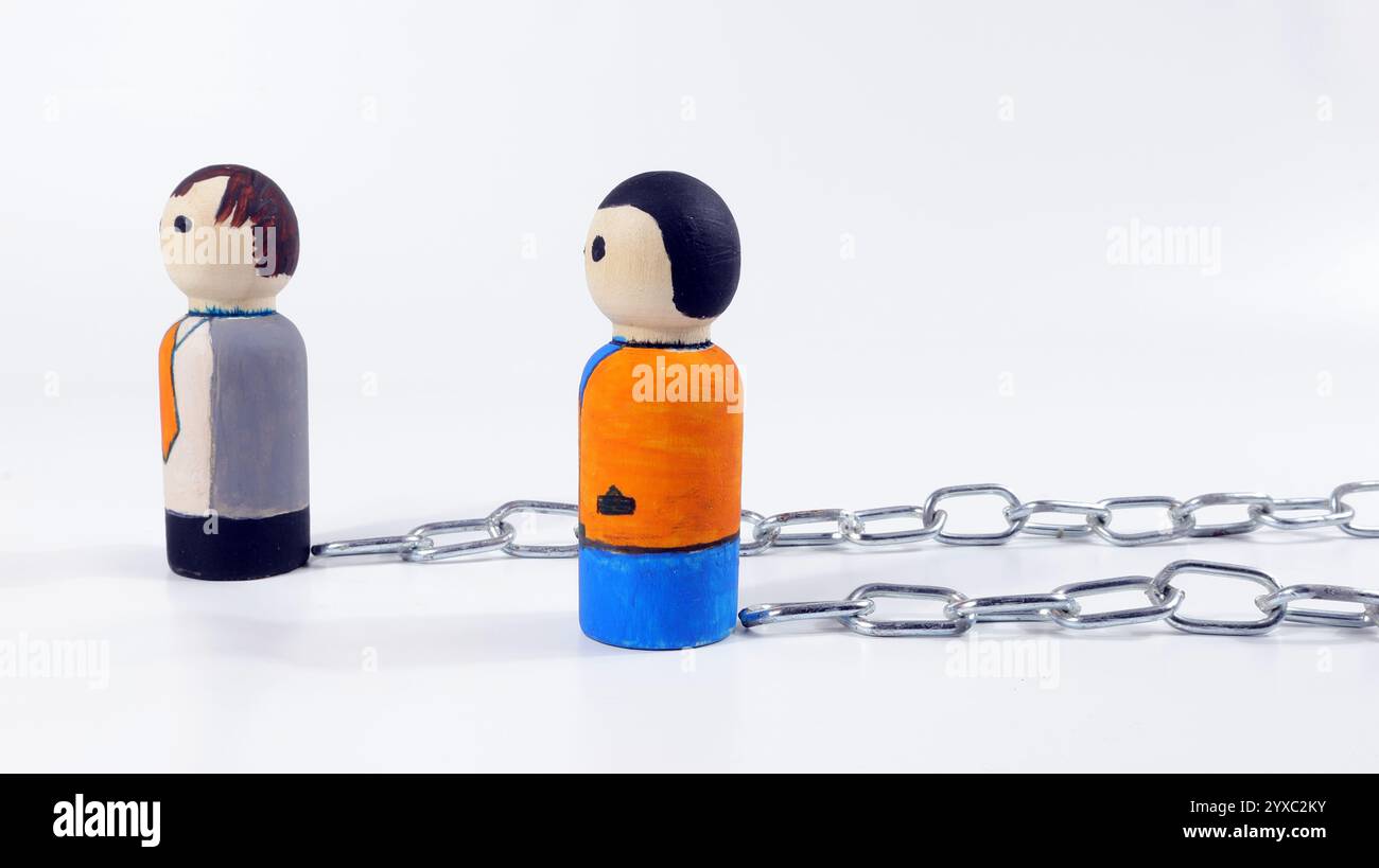 Two wooden mannequins pull iron chains with the idea of sadness Stock ...