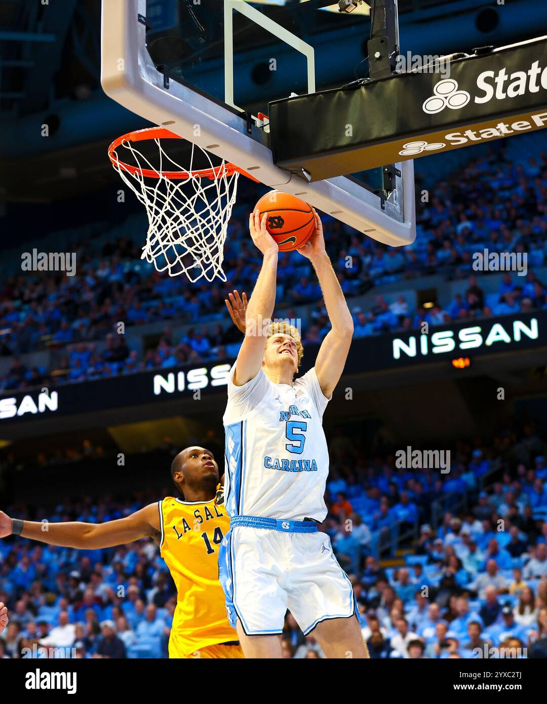 December 14, 2024: North Carolina junior Cade Tyson (5) goes up for ...