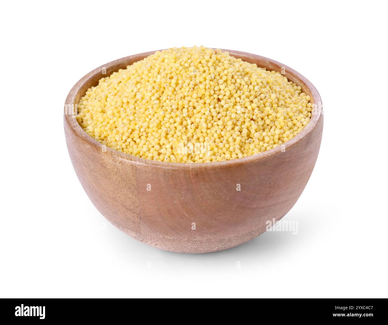 Millet groats in wooden bowl isolated on white Stock Photo - Alamy