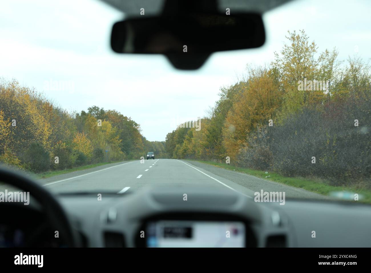 Car driving on asphalt road, view from inside through windshield Stock ...