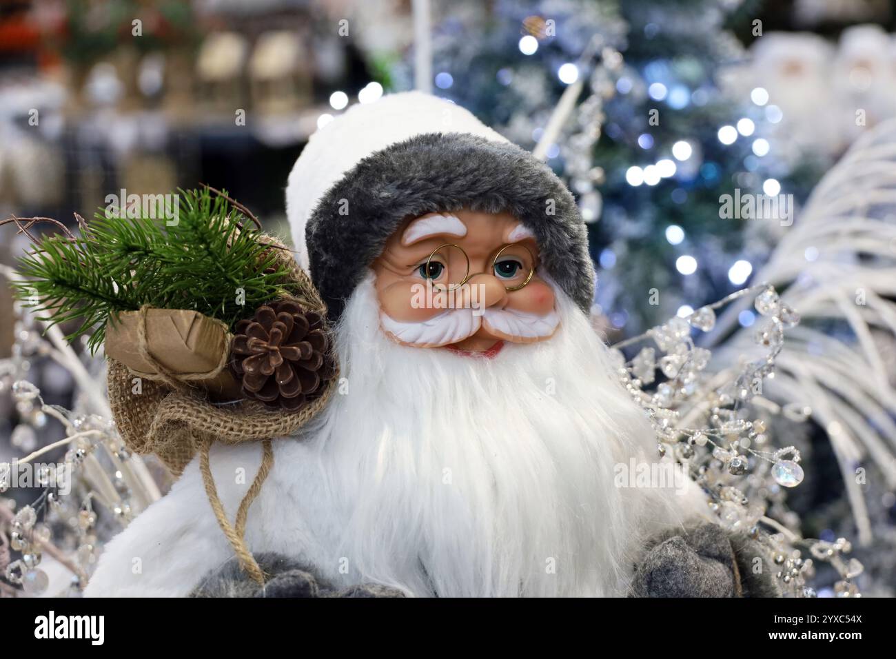 Christmas souvenir, Santa Claus figurine on blurred festive lights ...