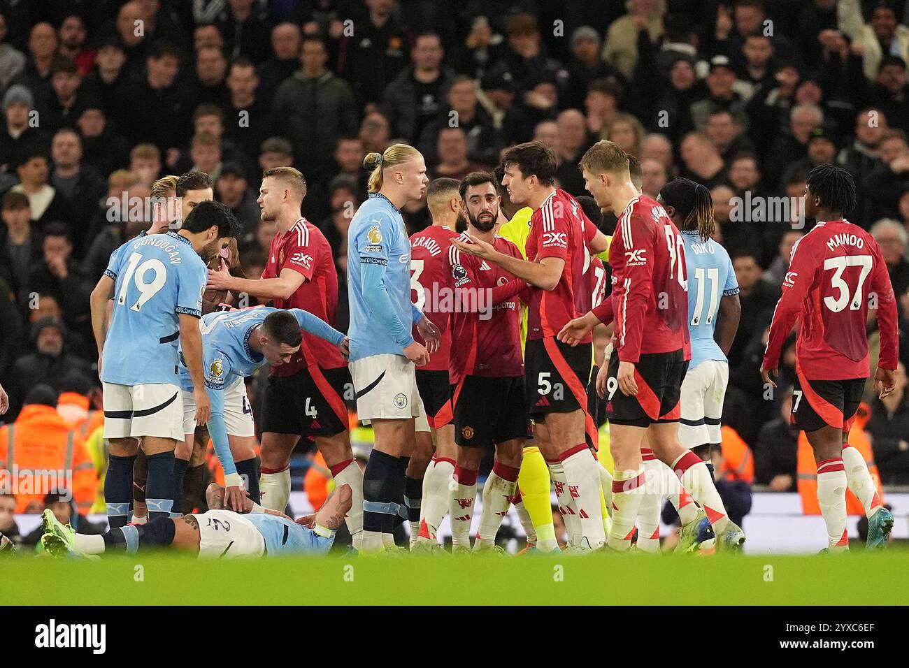 Tempers flare between players from both teams after a coming together between Manchester City's ...