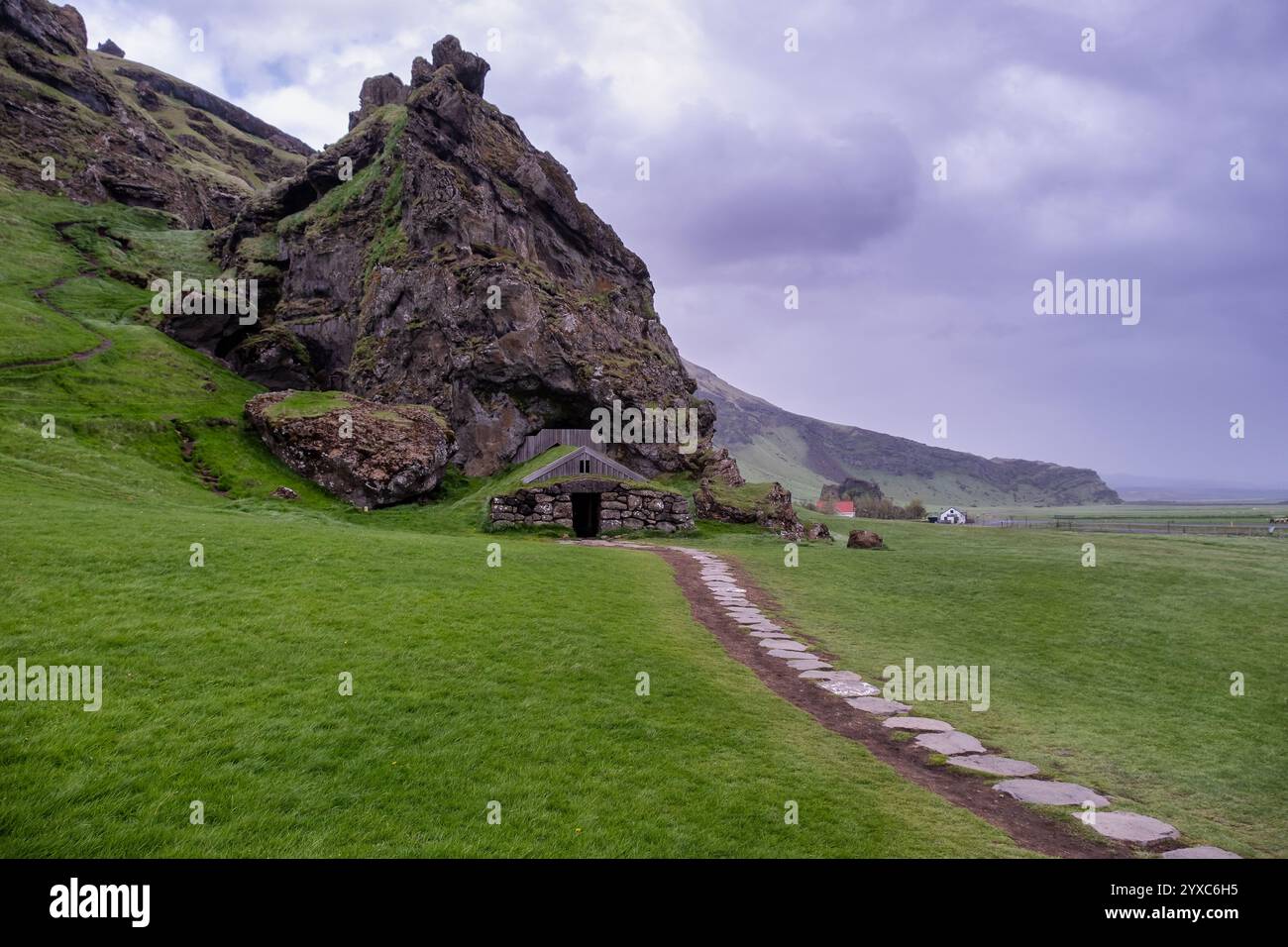 Historic Turf House Nestled at the Foot of a Rugged Extinct Volcano in ...