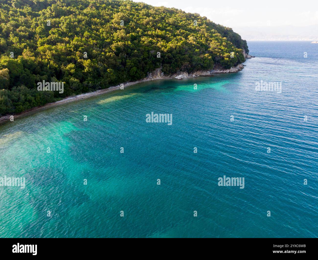 Green hillside meets turquoise hi-res stock photography and images - Alamy