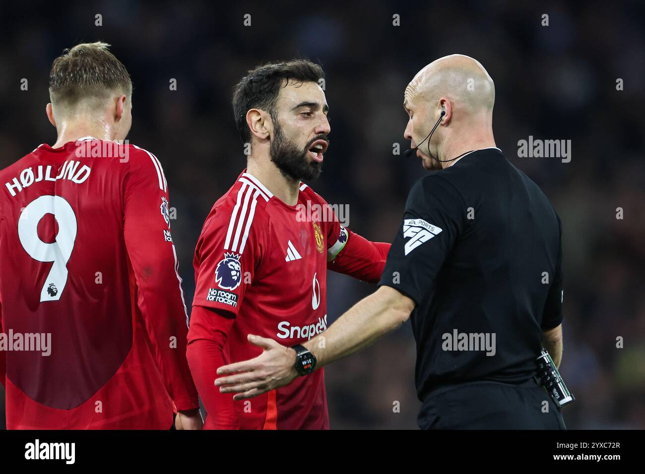 Referee Anthony Taylor speaks to Bruno Fernandes of Manchester United ...